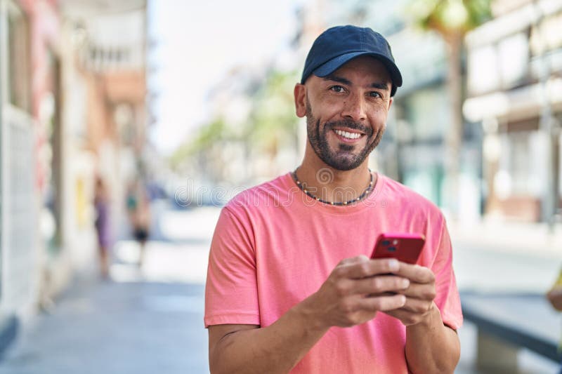 Young Bald Man Smiling Confident Using Smartphone at Street Stock Photo ...