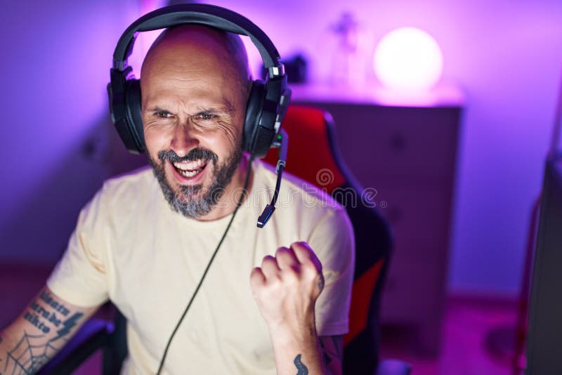 Young Bald Man Streamer Playing Video Game with Winner Expression at ...