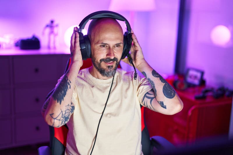Young Bald Man Streamer Smiling Confident Sitting on Table at Gaming ...