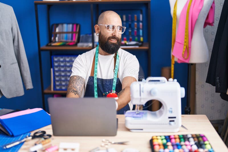 Young Bald Man Tailor Smiling Confident Using Laptop at Clothing ...