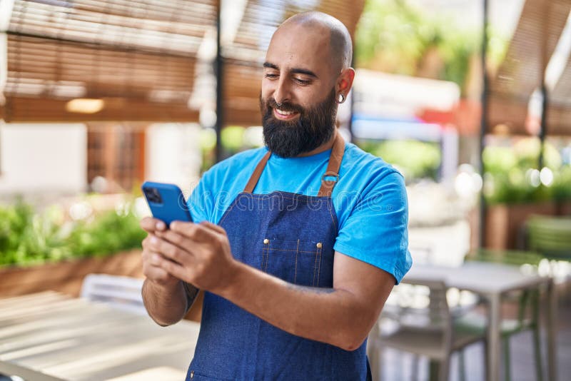 Young Bald Man Waiter Smiling Confident Using Smartphone at Coffee Shop ...