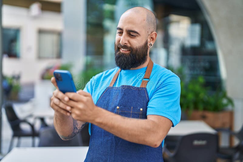 Young Bald Man Waiter Smiling Confident Using Smartphone at Coffee Shop ...
