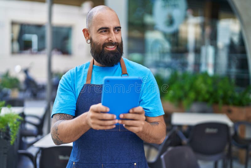 Young Bald Man Waiter Smiling Confident Using Touchpad at Coffee Shop ...