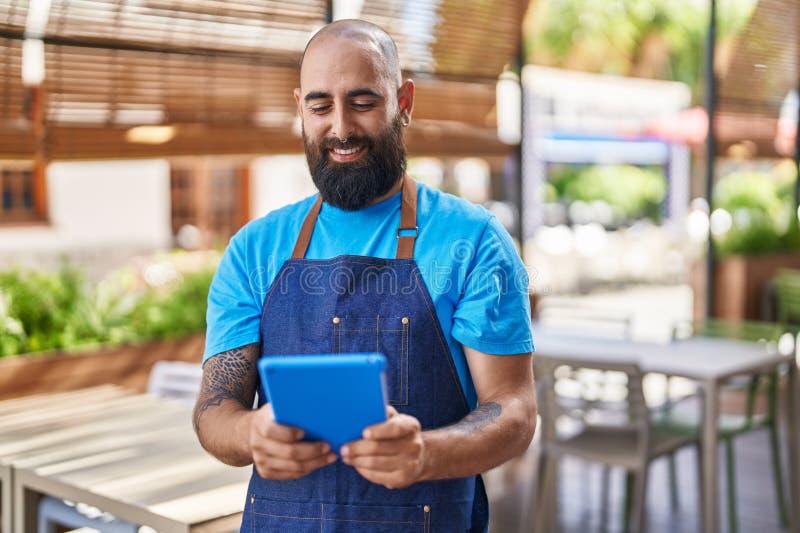 Young Bald Man Waiter Smiling Confident Using Touchpad at Coffee Shop ...