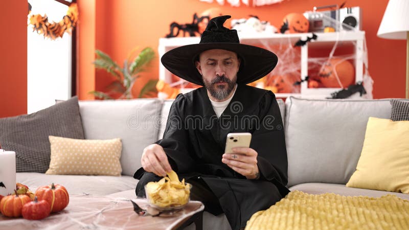 Young Bald Man Wearing Wizard Costume Eating Chips Potatoes Using ...