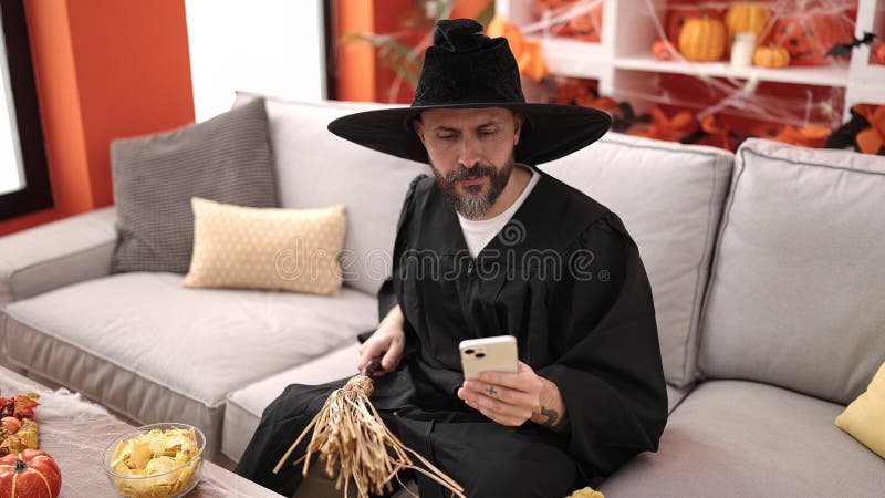 Young Bald Man Wearing Wizard Costume Using Smartphone Holding Broom at ...
