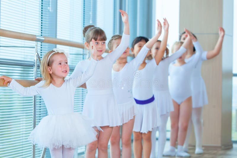 Young Ballerinas Rehearsing in the Ballet Class. they Perform Different ...