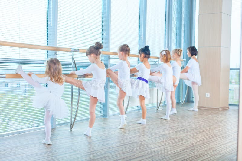 Young Ballerinas Rehearsing in the Ballet Class. they Perform Different ...