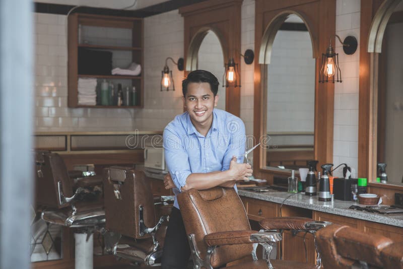 Young Barber Expert Smiling Looking at Camera in Barbershop Stock Photo ... Young Barber Expert Smiling Looking at Camera in Barbershop Stock Photo ...