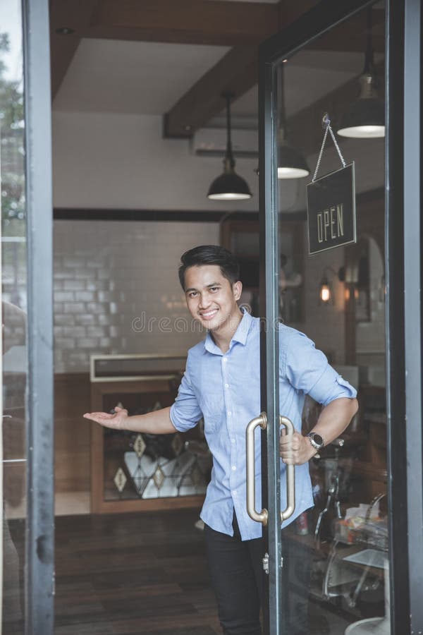 Young Barber Expert Smiling Welcoming Customer To His Barbershop Stock ... Young Barber Expert Smiling Welcoming Customer To His Barbershop Stock ...