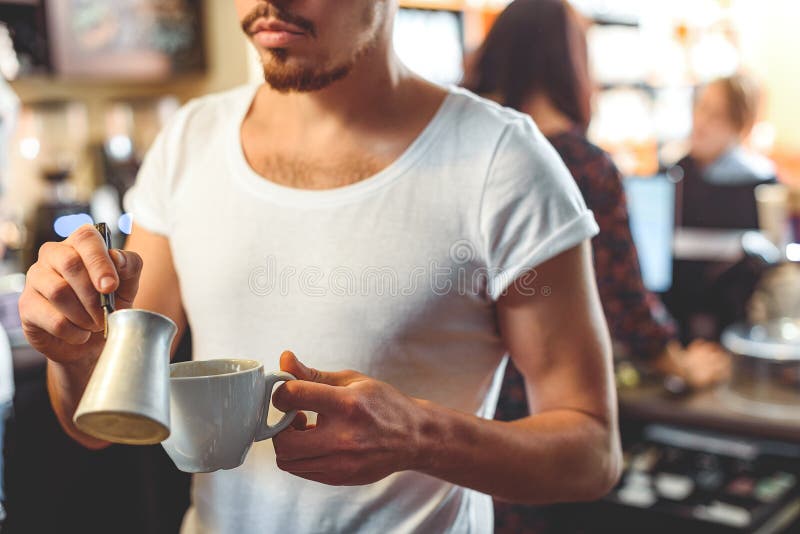 Young Barista Making a Latte Stock Photo - Image of cafeteria, beard ...