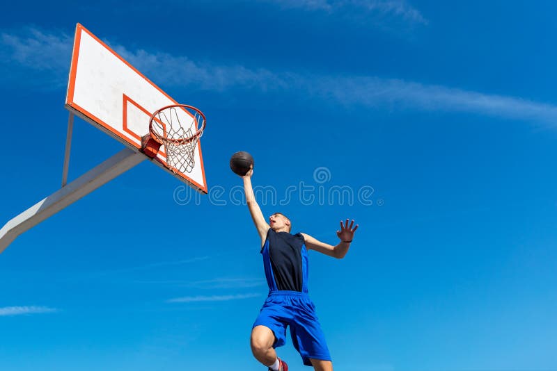 Young Basketball Street Player Making Slam Dunk Stock Photo - Image of ...