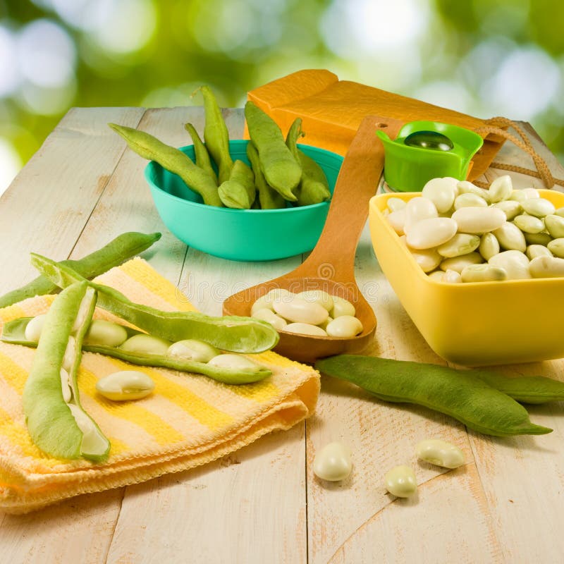 Young Beans in Pods on the Table on a Green Background Stock Image ...
