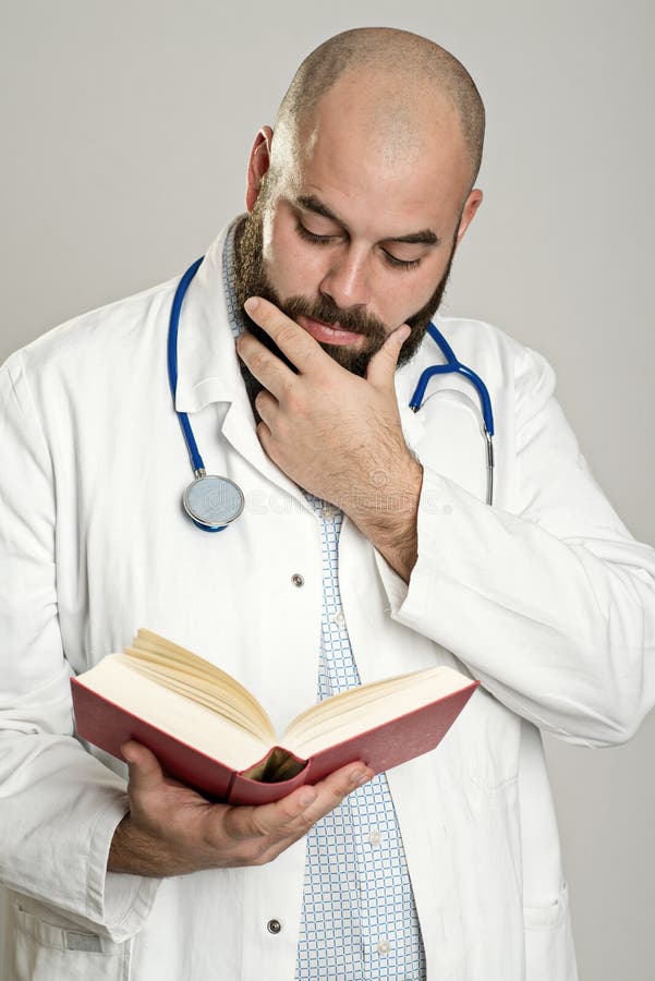 Young Bearded Doctor with Book Stock Photo - Image of handsome, beard ...