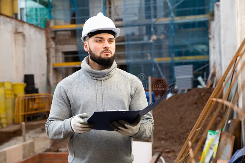 Foreman Making Task List during Building Works Stock Photo - Image of ...