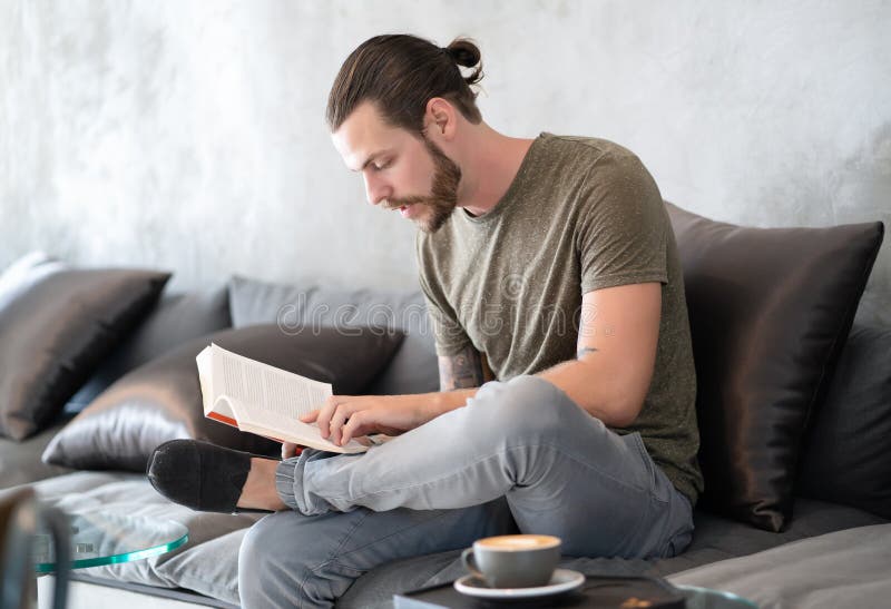 Young Bearded Hipster Guy Reading Book at Cafe.Lifestyle Concept Stock ...