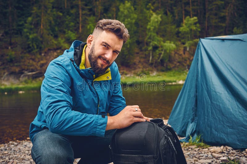 A Young, Bearded Man with a Backpack, Camping, Outdoors, Against the ...