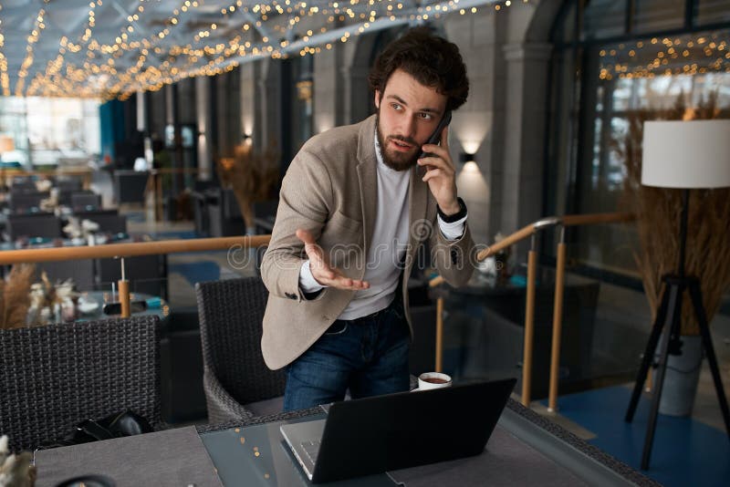 Young Bearded Man Explaining Something with Gestures Stock Photo ...