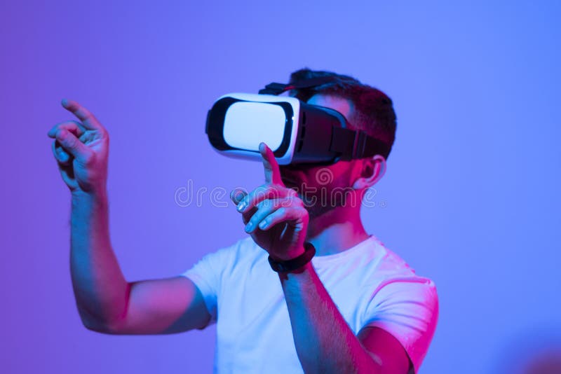 Young Bearded Man Playing Virtual Reality Game Using VR Goggles. Stock ... Young Bearded Man Playing Virtual Reality Game Using VR Goggles. Stock ...