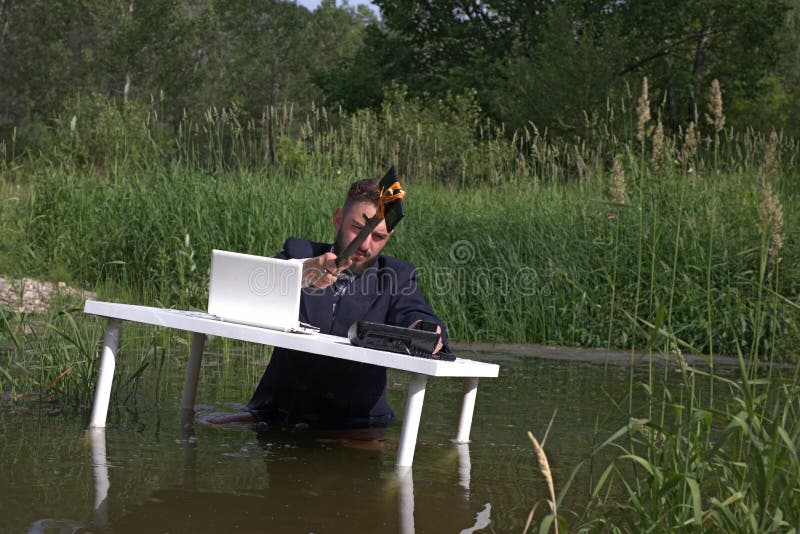 Young Bearded Millennial Man Tired of Office Work Doing Stupid Things ...