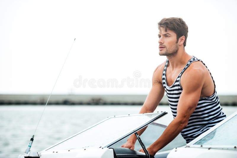 Young Bearded Sailor Man Driving His Motor Boat Stock Image - Image of ...