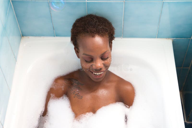 Young And Beautiful Afro American Woman Takes A Bubble Bath In The