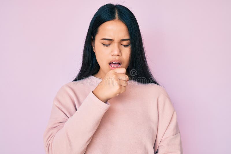 Young Beautiful Asian Girl Wearing Casual Pink Sweater Feeling Unwell