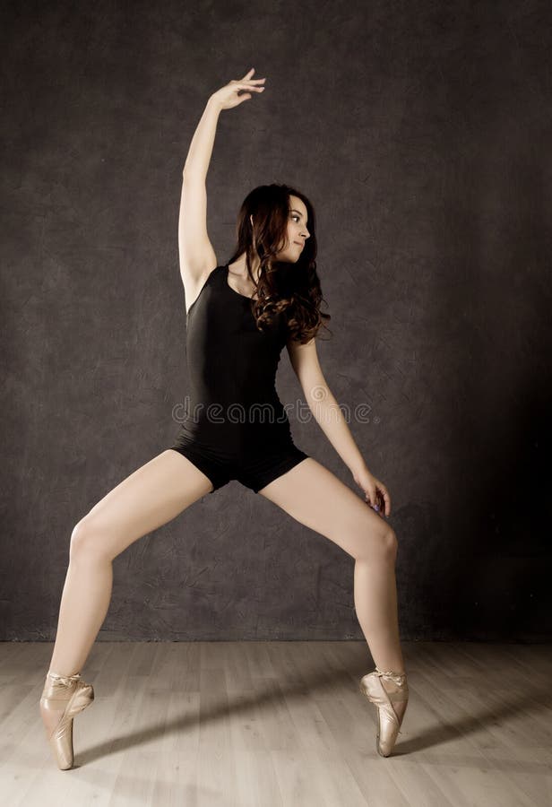 Young Beautiful Ballet Dancer in Pointe Shoes, Dancing in a Dark ...
