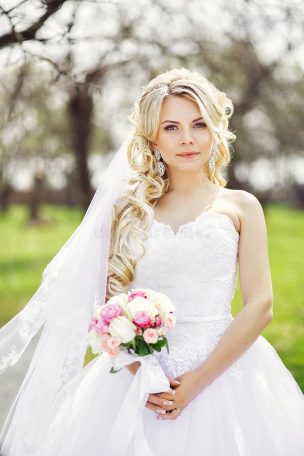 Young, Beautiful Bride with a Bouquet, is the Spring, Apple Orch Stock ...