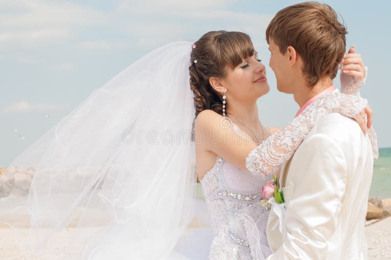 Young Bride and Groom on the Beach Stock Image - Image of celebrations ...