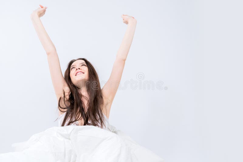 A Young Beautiful Brunette Woman Wakes Up In Her Bed Fully Rested A
