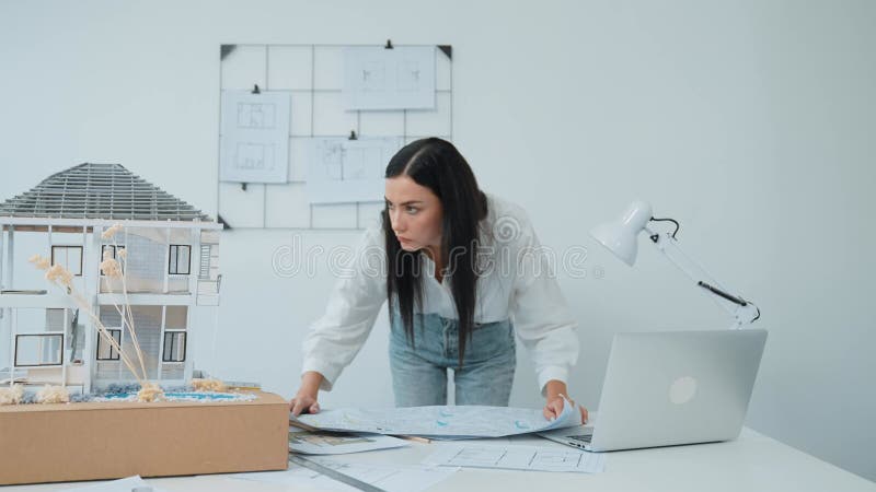 Architect Puts Blueprint on the Table and Compare with House Model ...