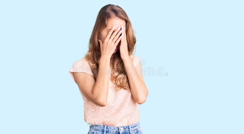 Young Beautiful Caucasian Woman With Blond Hair Wearing Casual Clothes