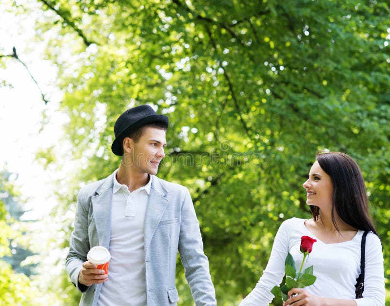 Young Beautiful Couple Having a Date in the Park Stock Photo - Image of ...