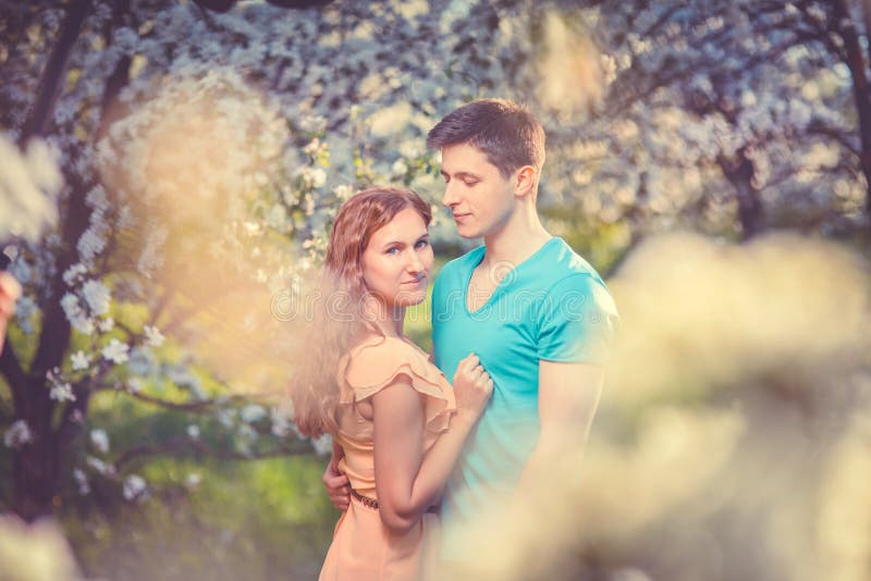 Young Beautiful Couple in Love among Apple Trees Stock Image - Image of ...
