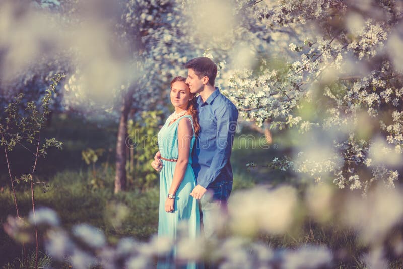 Young Beautiful Couple in Love among Apple Trees Stock Image - Image of ...