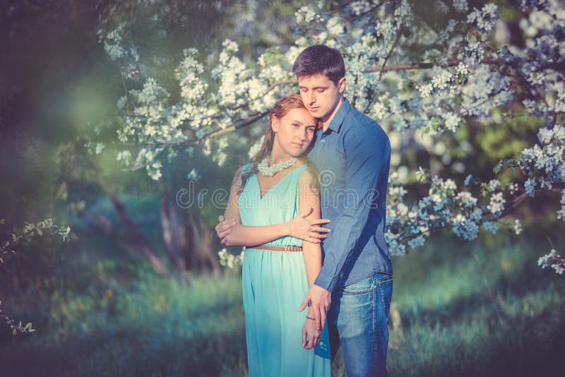 Young Beautiful Couple in Love among Apple Trees Stock Photo - Image of ...