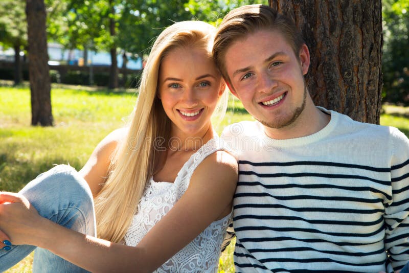Couple Resting Under a Tree Stock Photo - Image of colorful, attractive ...