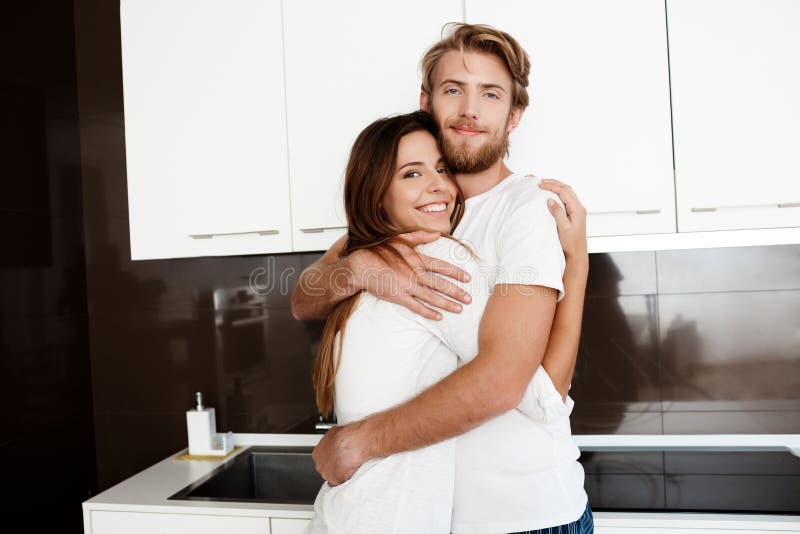 Young Beautiful Couple Smiling Embracing Standing at Kitchen. Stock ...