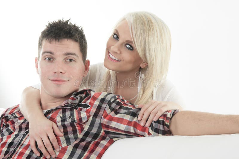 Young Beautiful Couple on a Sofa at Home Stock Photo - Image of ...