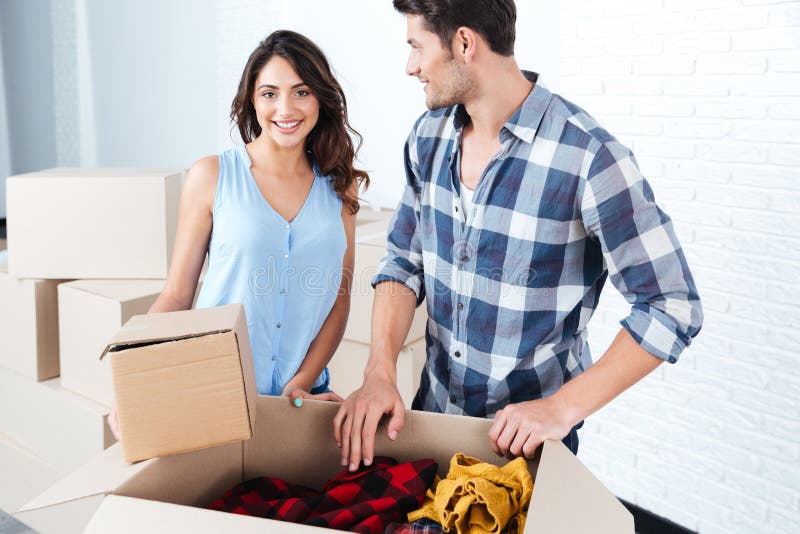 Young Beautiful Couple Unpacking in New Flat Stock Image - Image of ...