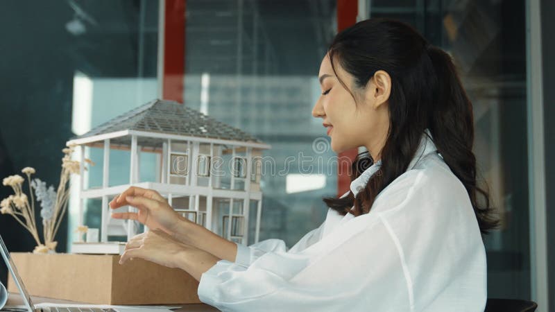 Young Beautiful Engineer Checking Roof Material and Using Laptop ...