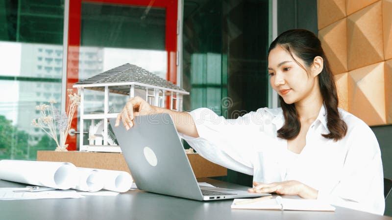 Young Beautiful Engineer Checking Roof Material and Using Laptop ...