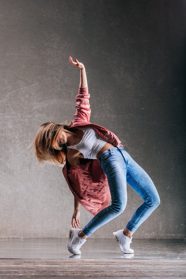 Young Beautiful Female Dancer is Posing in the Studio Stock Image ...