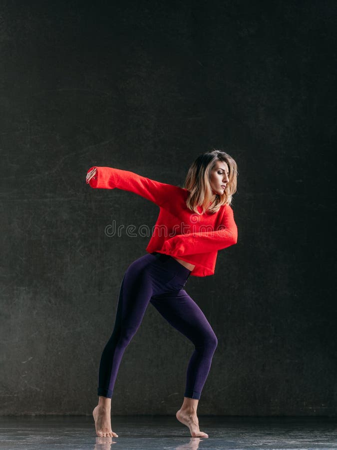 Young Beautiful Female Dancer is Posing in the Studio Stock Image ...