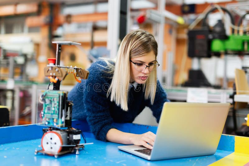 Young Beautiful Female Engineer Testing and Programming Stock Image ...