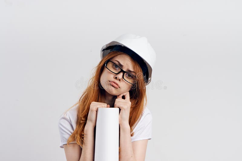 Young Beautiful Female Engineer on White Background Holds Blueprints ...
