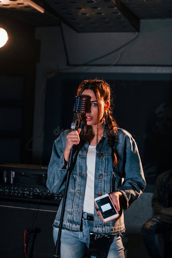Young Beautiful Female Performer Rehearsing in a Recording Studio Stock ...