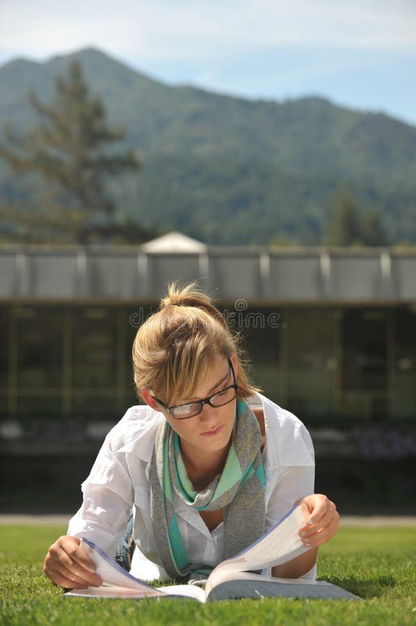 Young Beautiful Female Student on Campus Stock Image - Image of laying ...