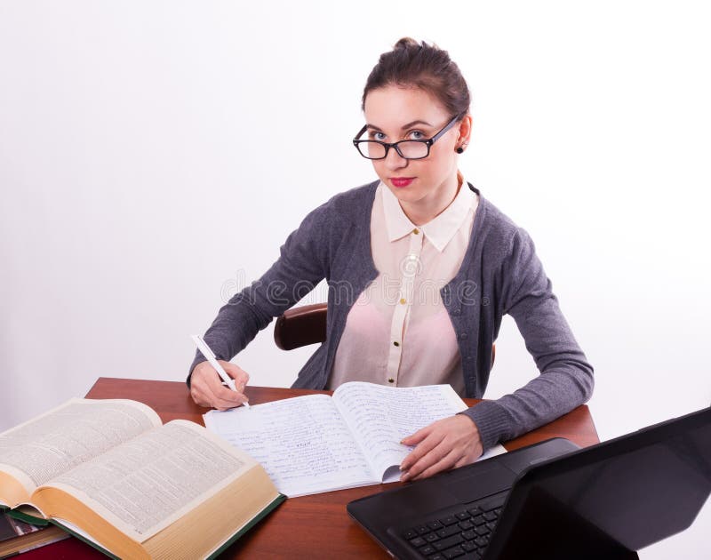 Young Beautiful Female Teacher Sitting at a Table Stock Photo - Image ...